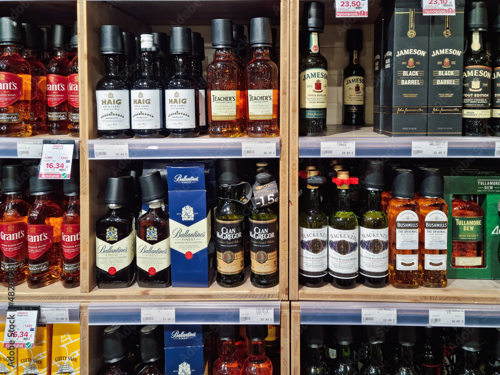 liquor store display with various brands. Supermarket shop interior ...