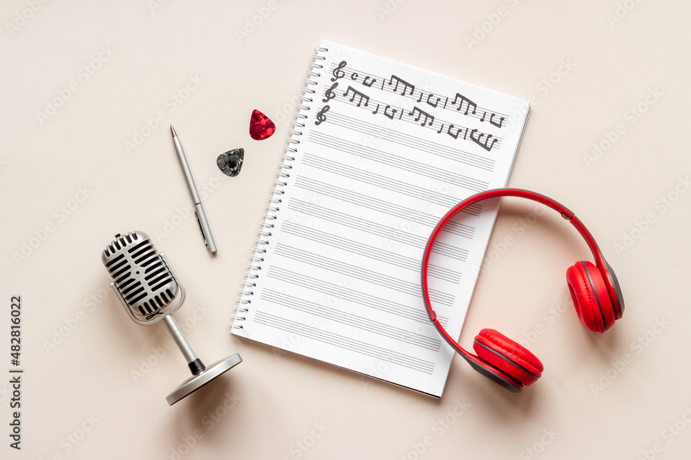 Music sheets with musical notes and microphone, top view Stock Photo ...