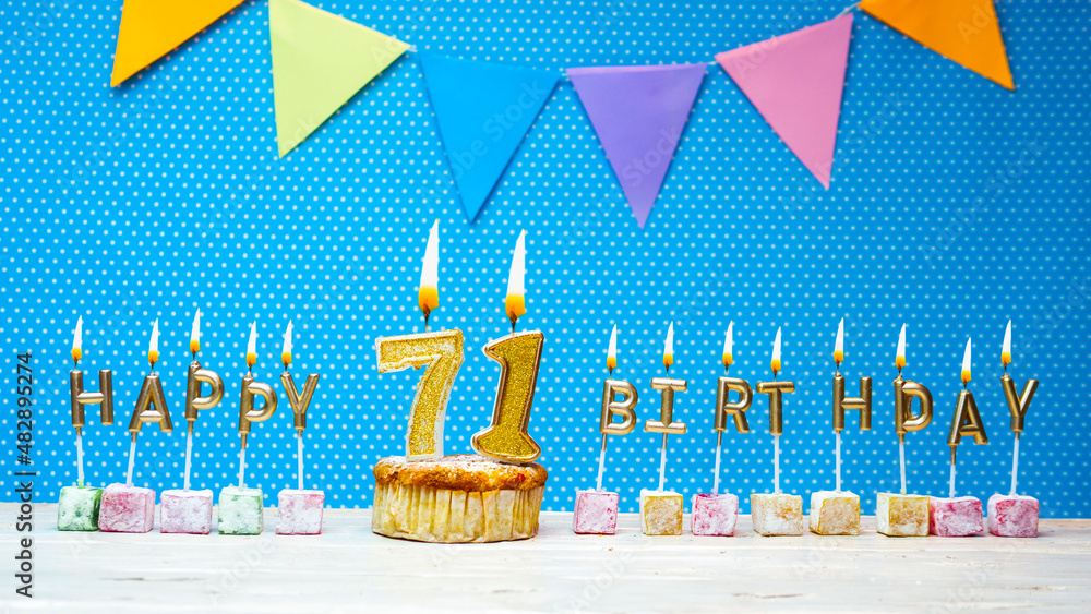 Happy birthday from number 71 candle letters on a blue background with ...