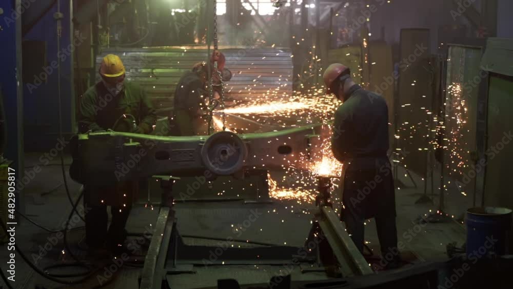 Factory Workers Process Steel Structure With Cutting Tools. Bright ...