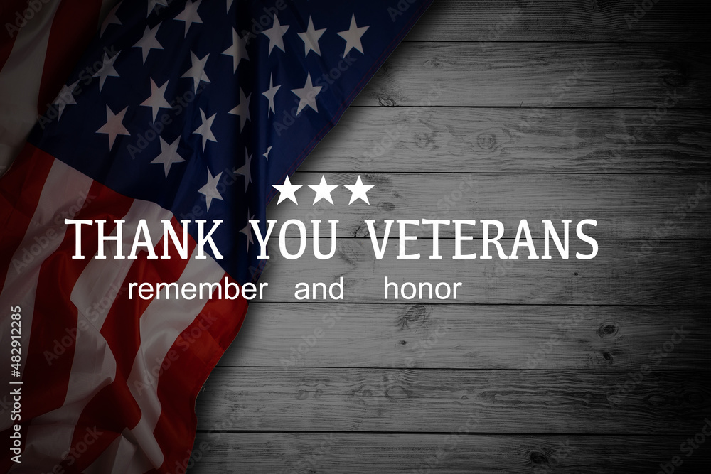 Flat lay, top view United States of America flag is on left of dark ...