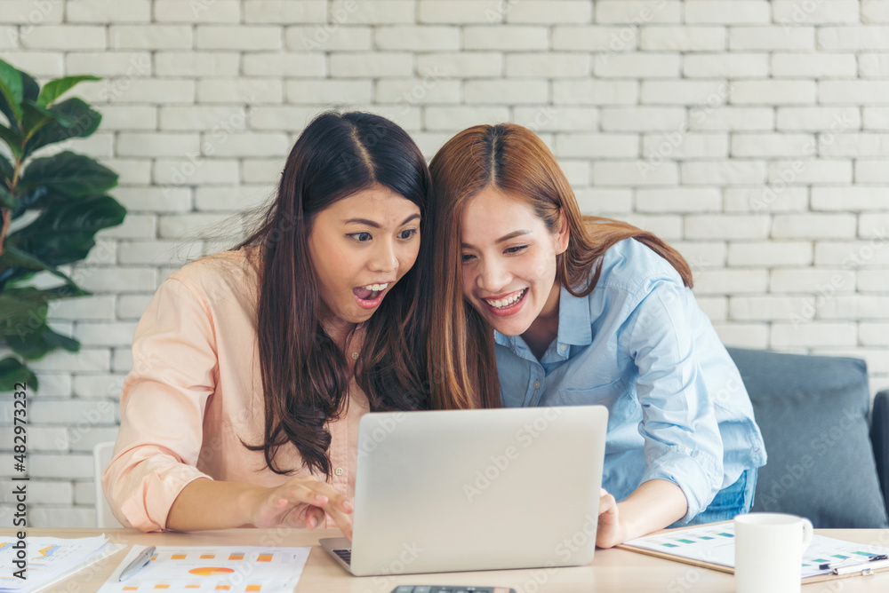 Asian colleague friendship at work with smiling face. Happiness two ...