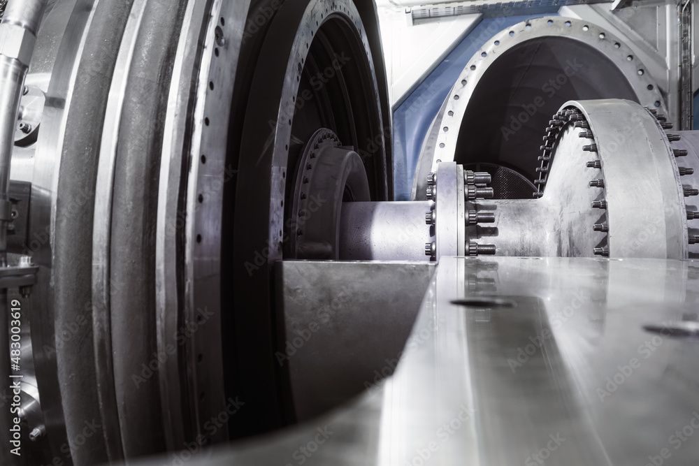 The rotor of a gas turbine compressor with a bolted coupling half ...