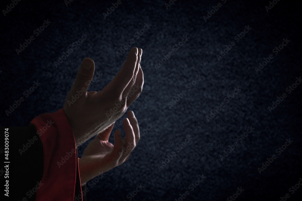 Praying hands on dark background concept for religion and human Stock ...