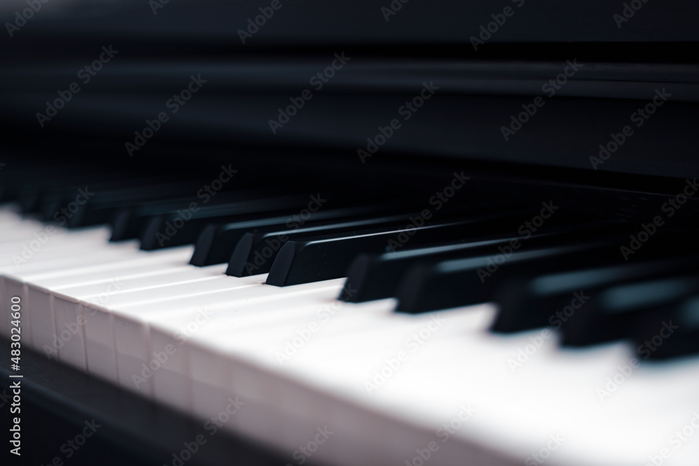 Piano and Electronic piano keyboard with black backgrounds. Closeup of ...
