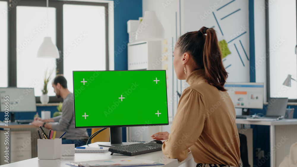 Company worker using computer with green screen in office. Business ...