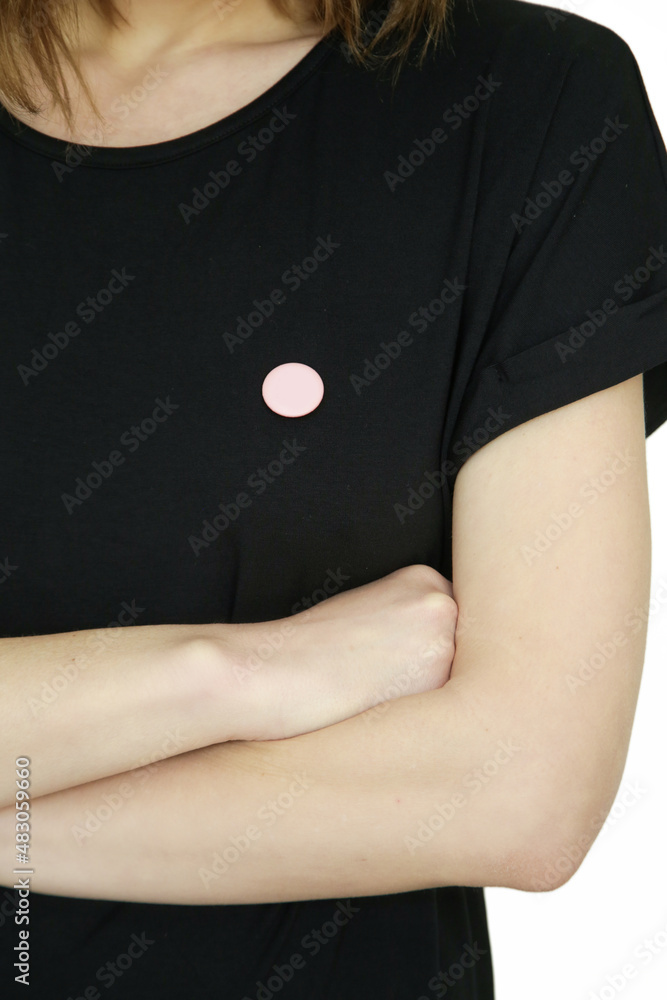 Small button badge pinned onto black shirt Stock Photo | Adobe Stock