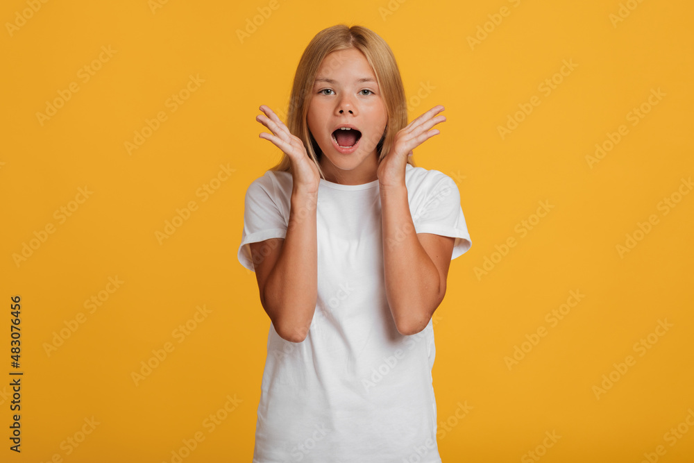 Scared surprised shocked european teenager girl in white t-shirt ...