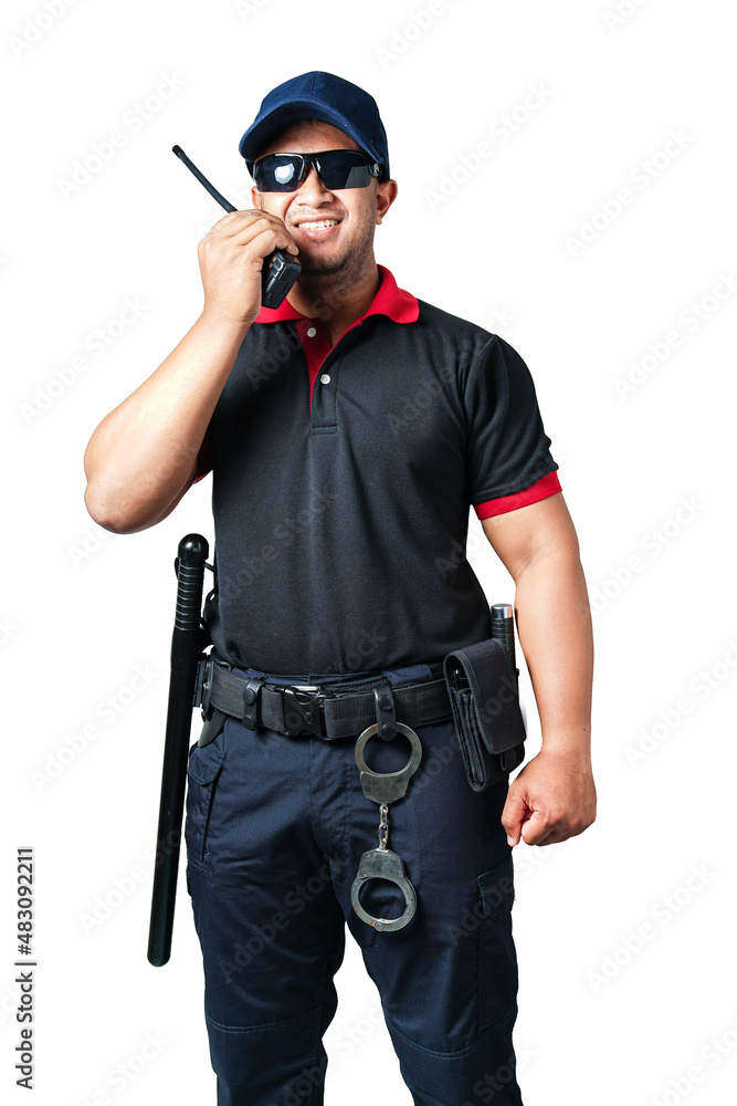 security guard wears dark glasses and wears a hat.holding a walkie ...