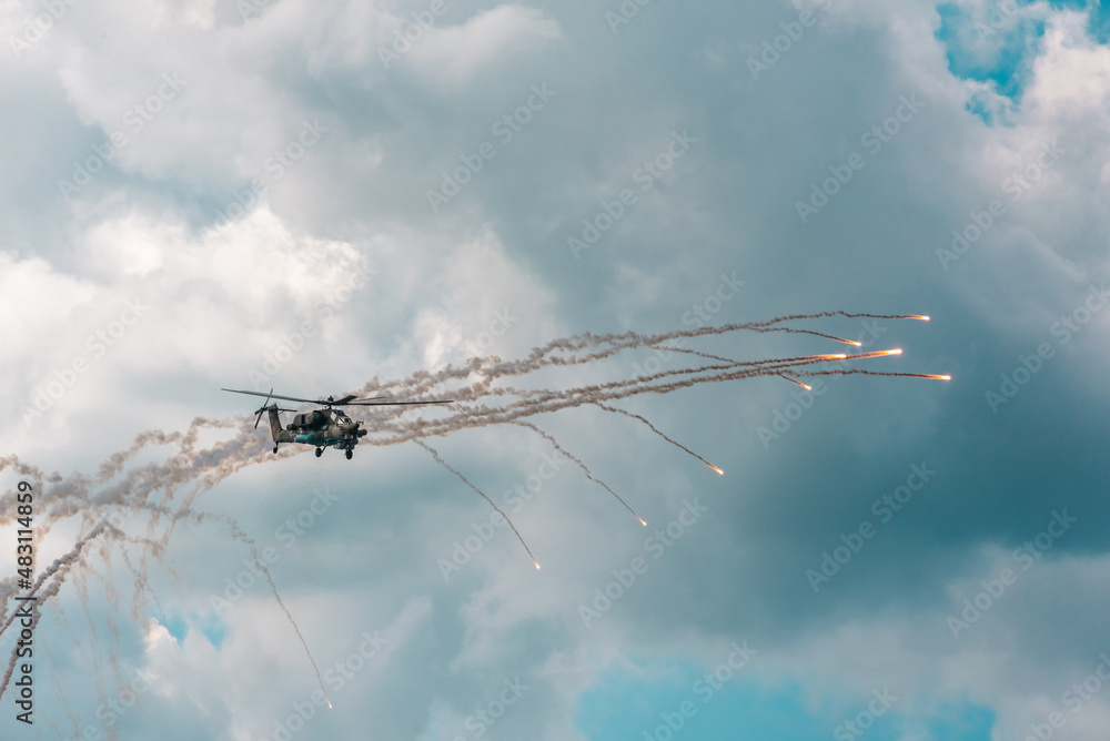 Russian Military attack helicopter shooting flares at the MACS air show ...