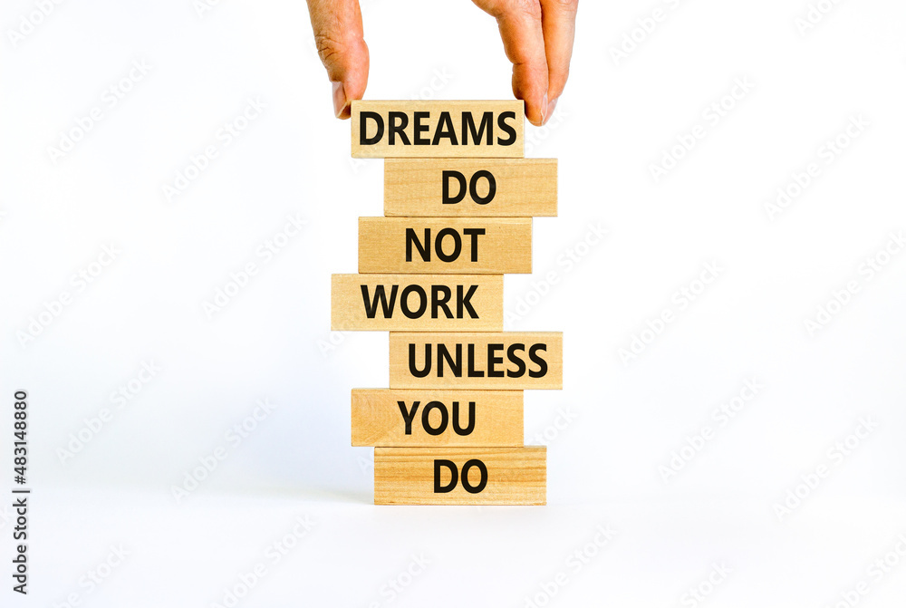 Dream and do symbol. Wooden blocks with words Dream do not work unless ...