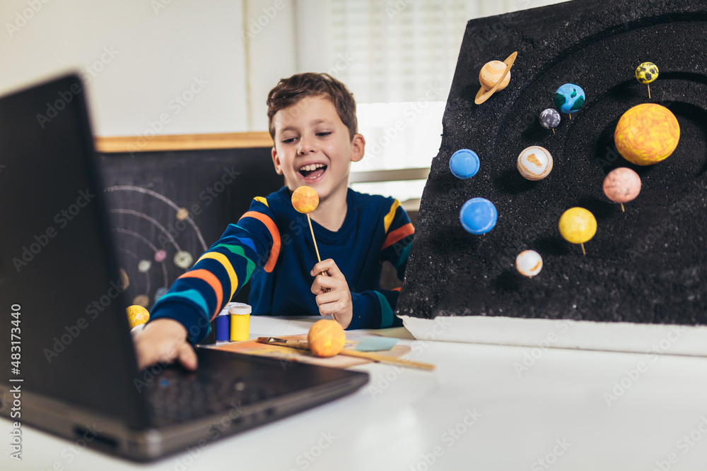 Kid presenting his science home project - the planets of our solar ...