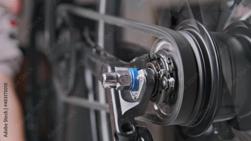 The planetary hub on a belt drive bicycle rotating. Rotation of the ...