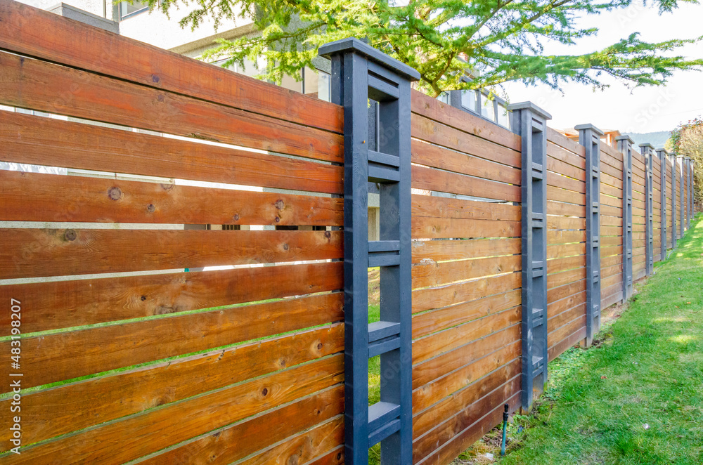 Fence built from wood. Outdoor landscape. Security and privacy concept ...