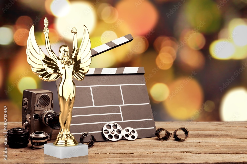 Golden film award with reel video tape Stock Photo | Adobe Stock