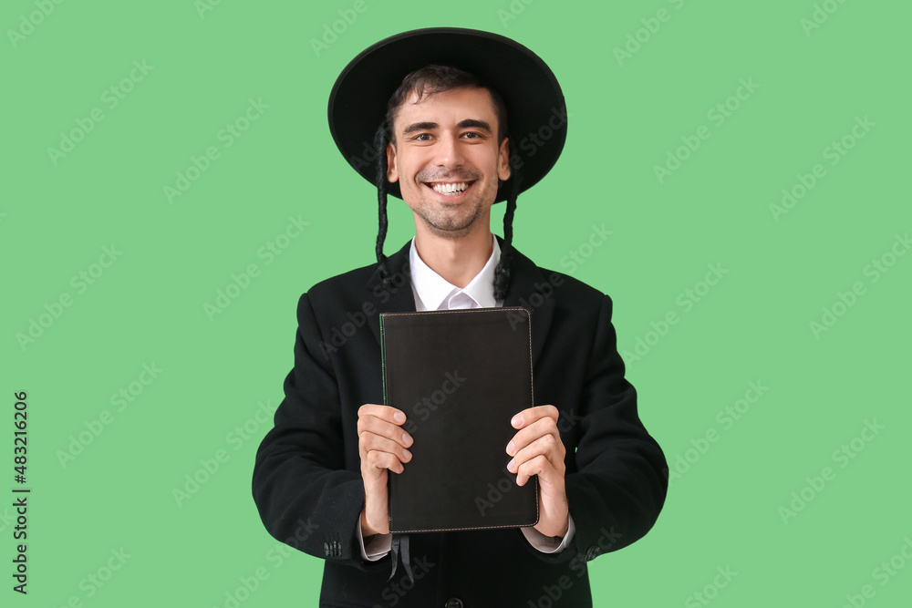 Hasidic Jewish man with Torah on color background Stock Photo | Adobe Stock