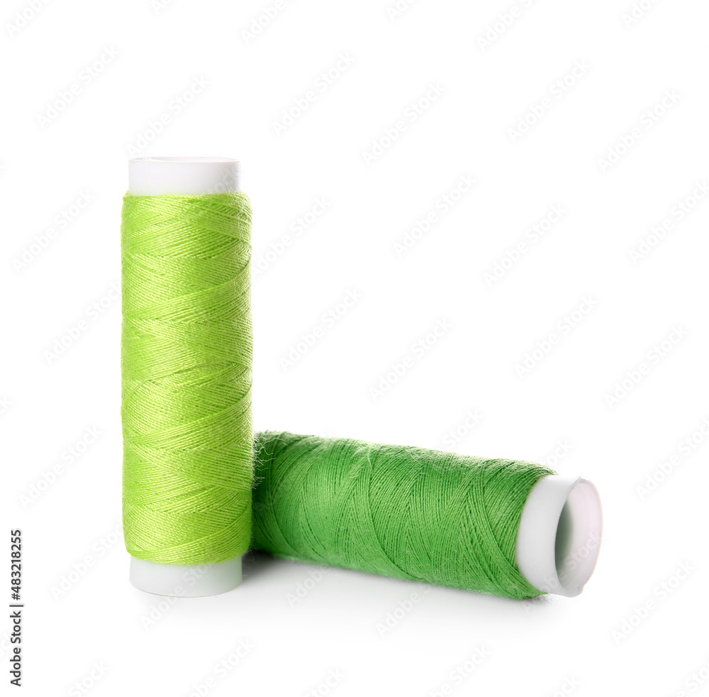Sewing thread spools on white background Stock Photo | Adobe Stock