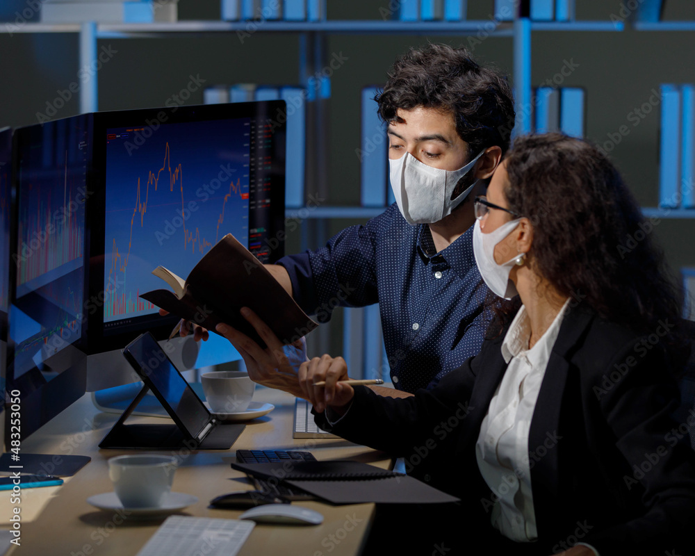 Caucasian male stock investor discussing with African American female ...