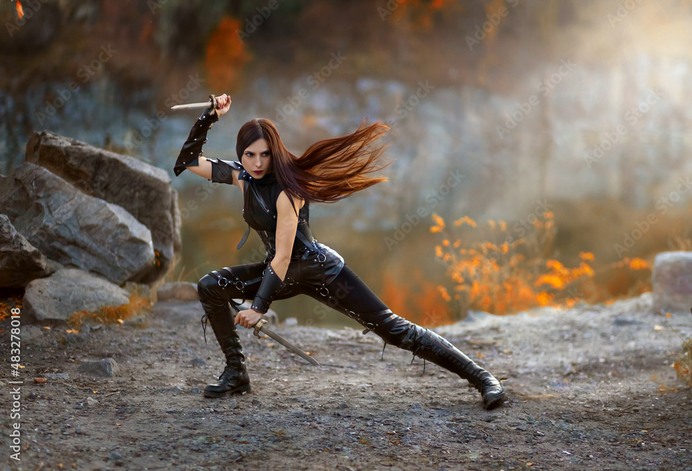 Foto de Fantasy fighting woman assassin actions in motion battle, hold ...