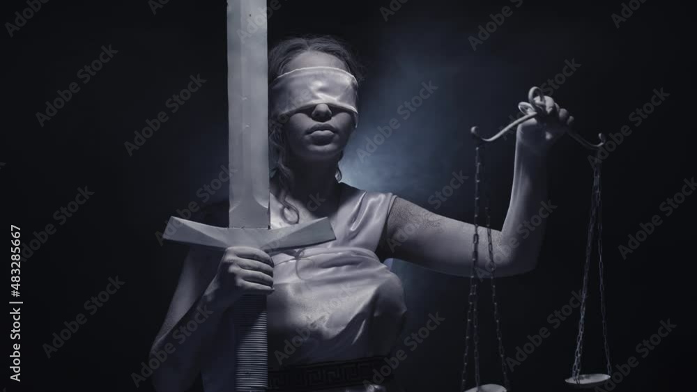 Greek goddess Themis stands on black background with moving smoke in ...