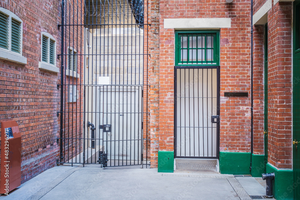 Wall and interior of a old building, previous police station and prison ...