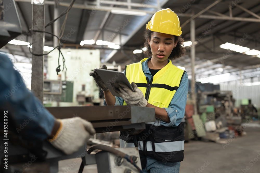 Engineer woman and mechanic hard work with machine at factory ...