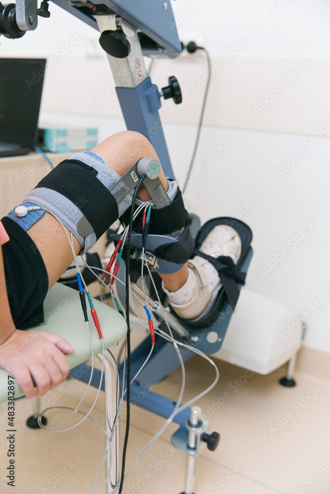 Patient on Continuous Passive Range of Motion machines. Device to ...