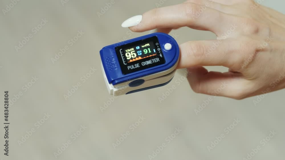 Close-up on a finger in a pulse oximeter. Check the pulse of the oxygen ...