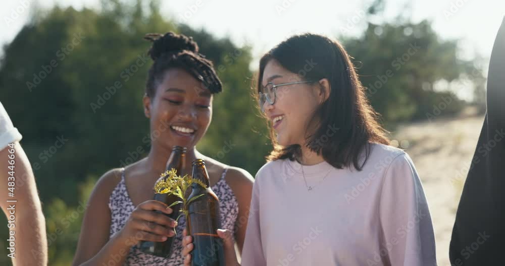 A Korean-looking woman in glasses with gentle facial features walks ...