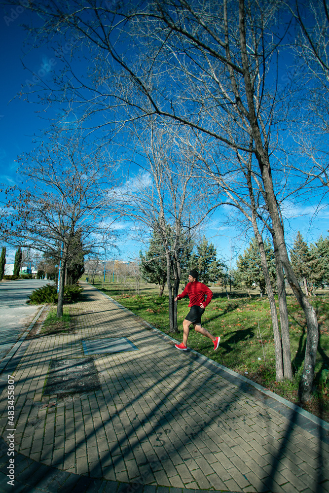 Series Running man with red shoe. Detail of the legs in wide angle of a ...