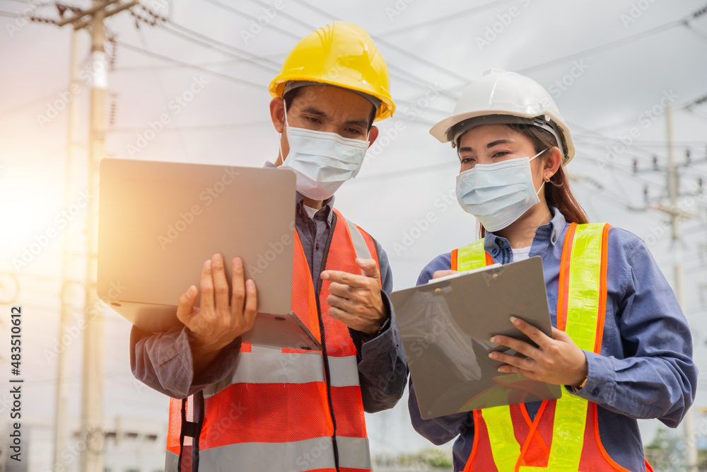 Team electrical engineer on site service outdoor, Teamwork success ...