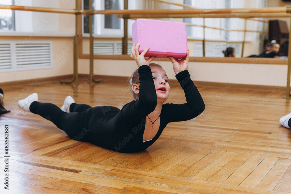 A group of girls doing gymnastics doing gymnastic exercises. Stock ...