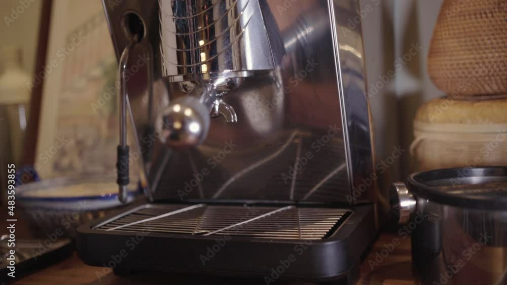 Man is filling coffee machine with ground coffee for fresh espresso ...