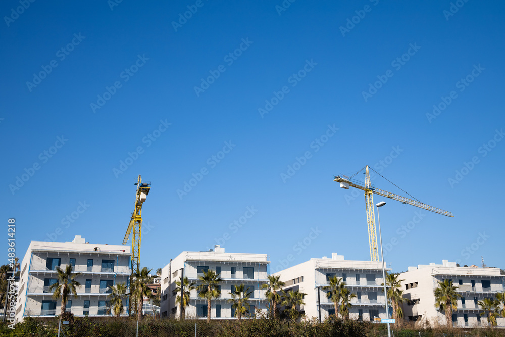 New homes construction in Spain, crane building new house, new street ...