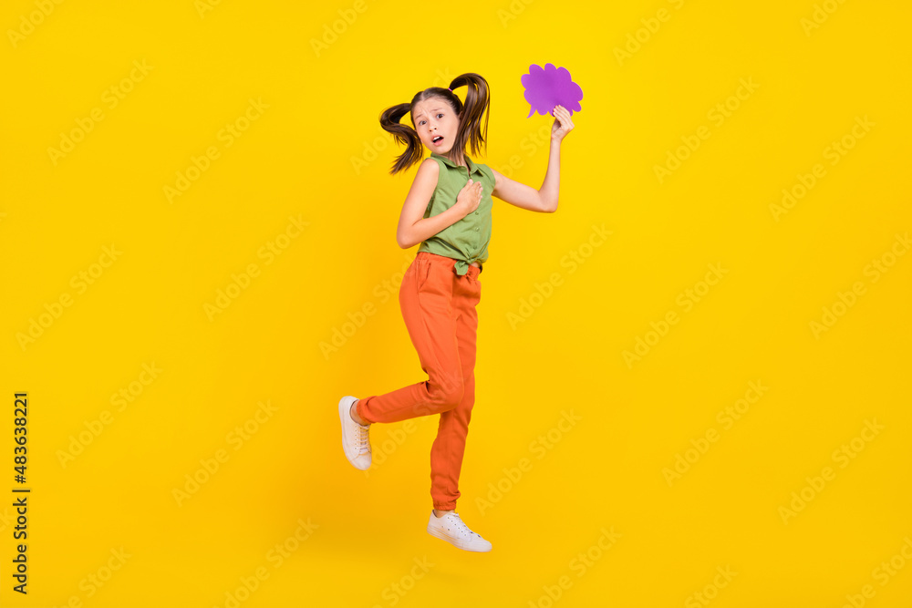 Photo of sweet impressed preteen girl dressed green top jumping high ...