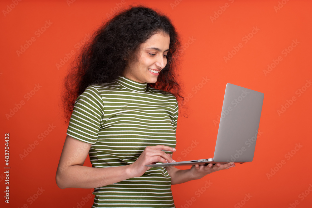 Portraits of young girl holding laptop Stock Photo | Adobe Stock