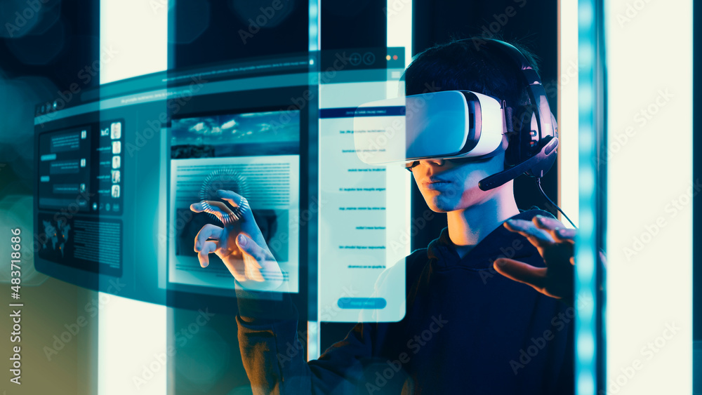 Teenager interacting with virtual screens Stock Photo | Adobe Stock