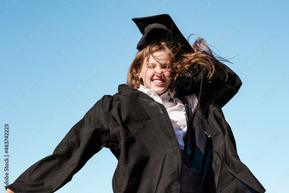 Cute teenage graduate girl laughing and having fun. No school, back to ...
