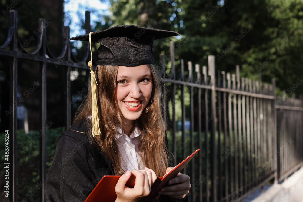 Cute teenage graduate girl laughing and having fun. No school, back to ...