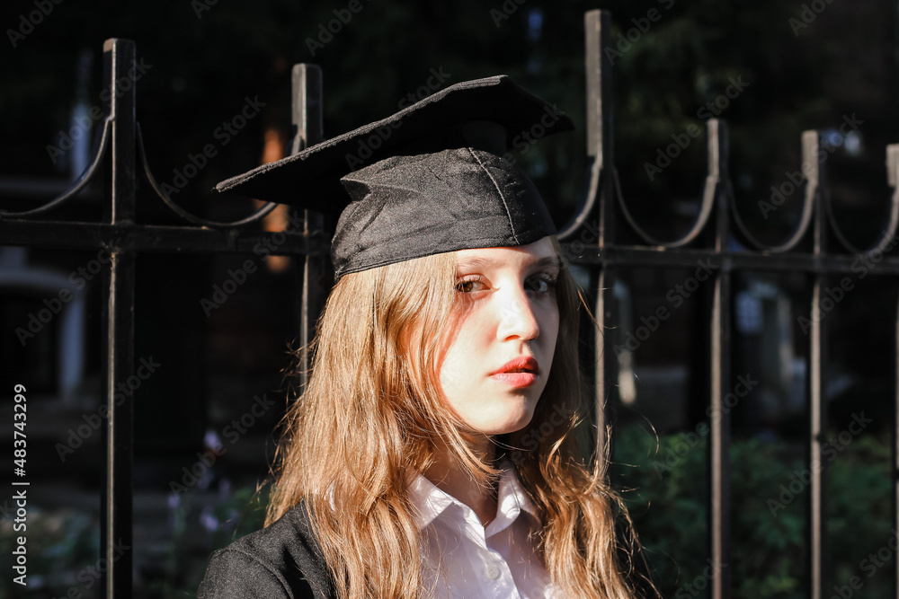 Cute teenage graduate girl laughing and having fun. No school, back to ...