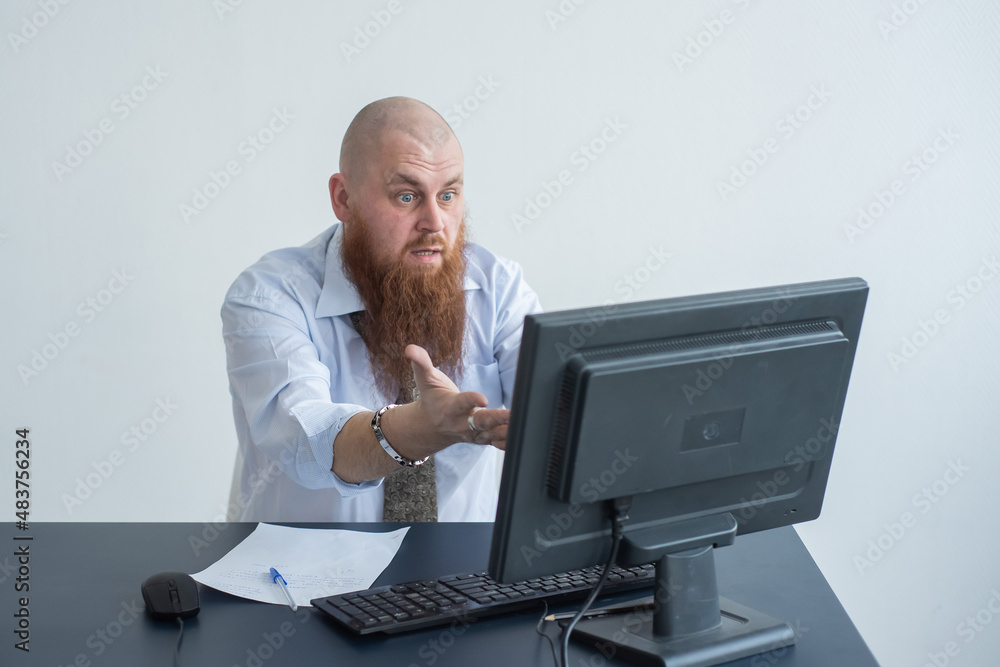 Problems for the office worker. A bald man in a white shirt sits at a ...