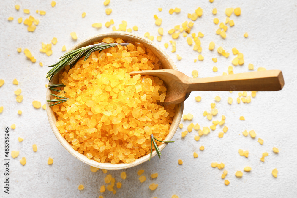 Bowl of orange sea salt with scoop on light background Stock Photo ...