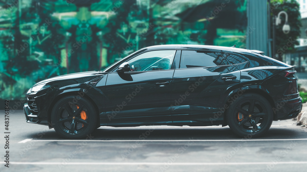 Lamborghini Urus super SUV in parking slot, side view Stock Photo ...