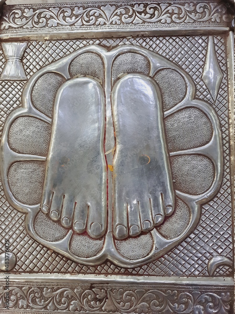 Siver foot print of hindu god, called as foot (charan). Stock ...
