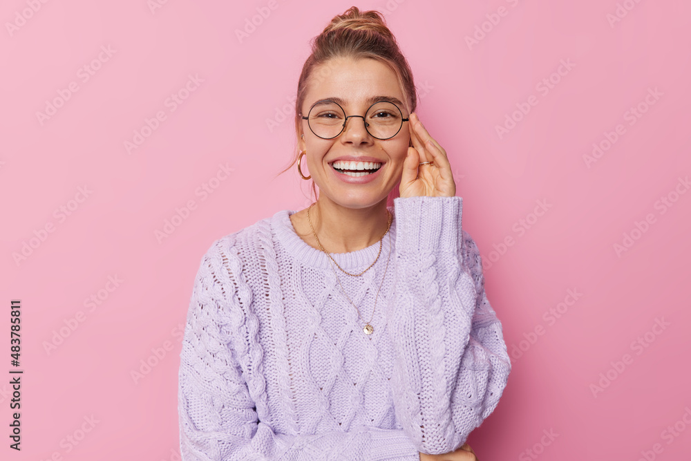 Portrait of pleasant looking woman smiles broadly shows perfect white ...