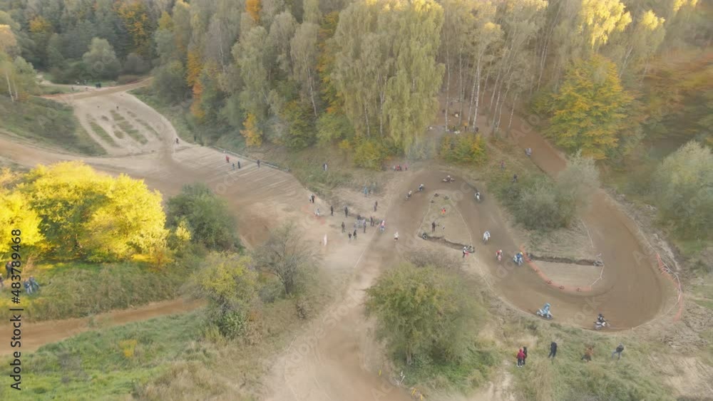 Motorcyclists make a sharp turn during a motocross race. Off-road ...