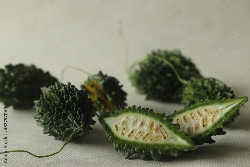 Bitter gourd, also known as pavakka or karela. Shot on white background ...