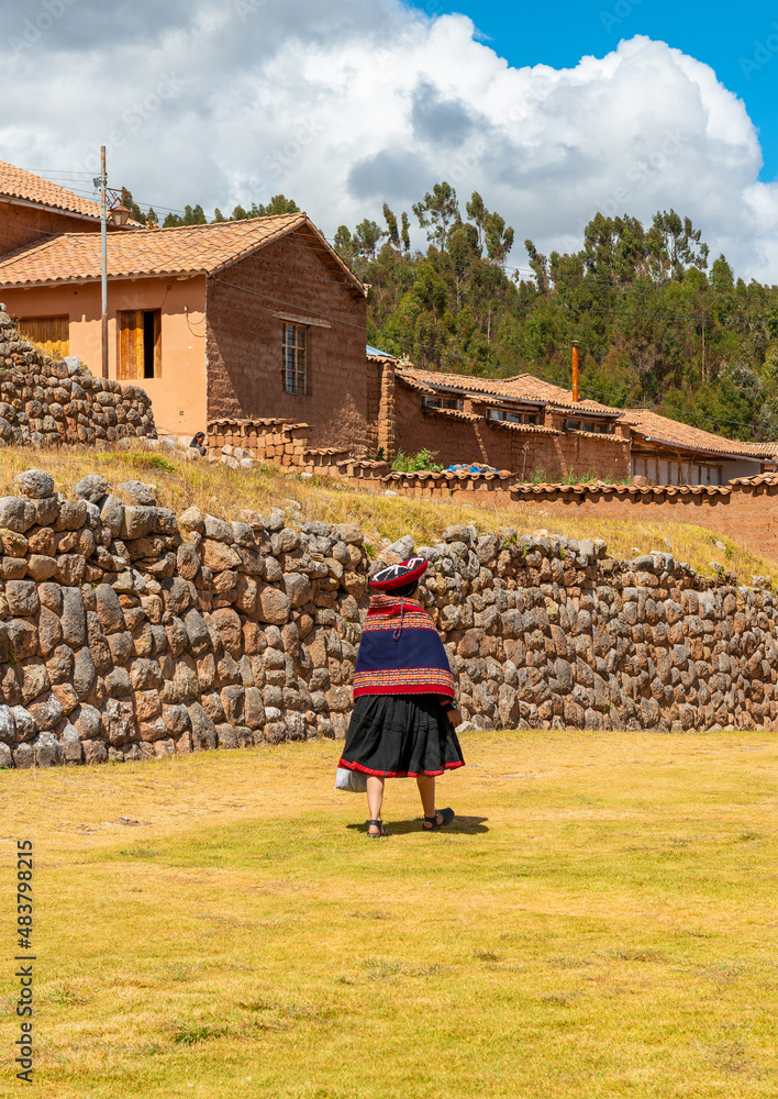 Peruvian indigenous quechua woman in traditional clothing walking in ...
