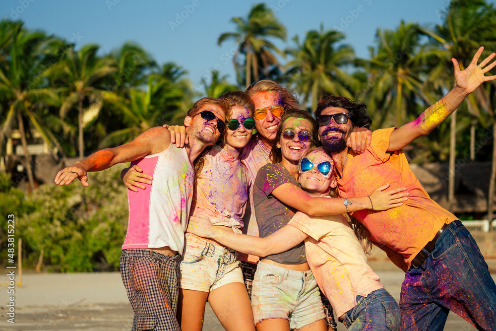 happy people taking self portraits on smartphone in India Goa fest ...