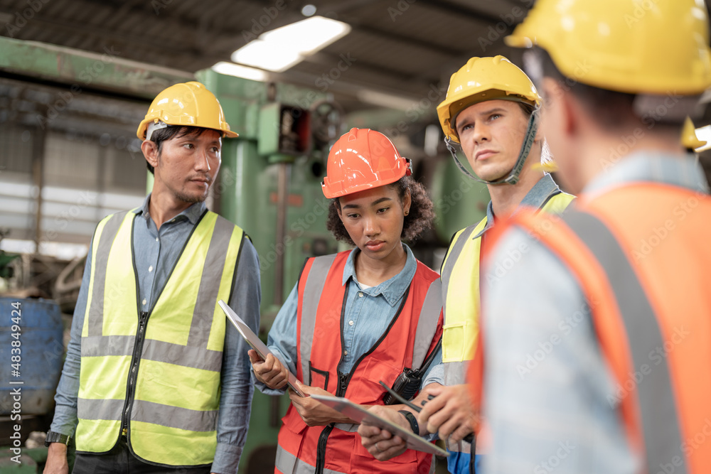 Professional engineering workers walk and check in warehouse factory ...